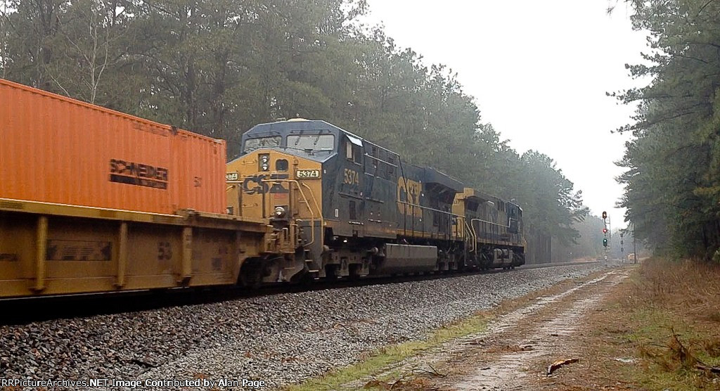 On a rainy March 28, CSX AC44CW 337 and ES40DC 5374